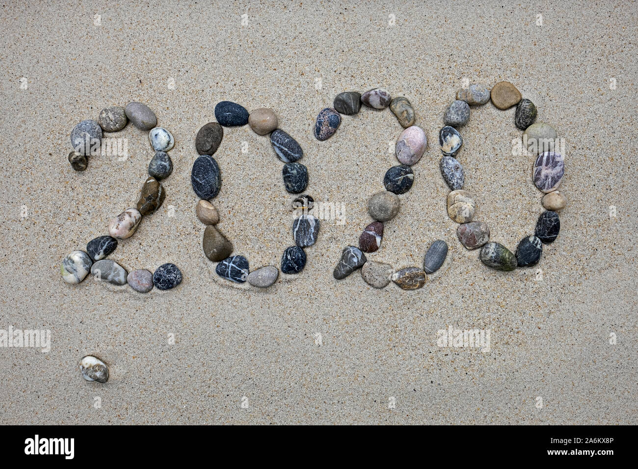 2020 written with pebbles in sand Stock Photo - Alamy