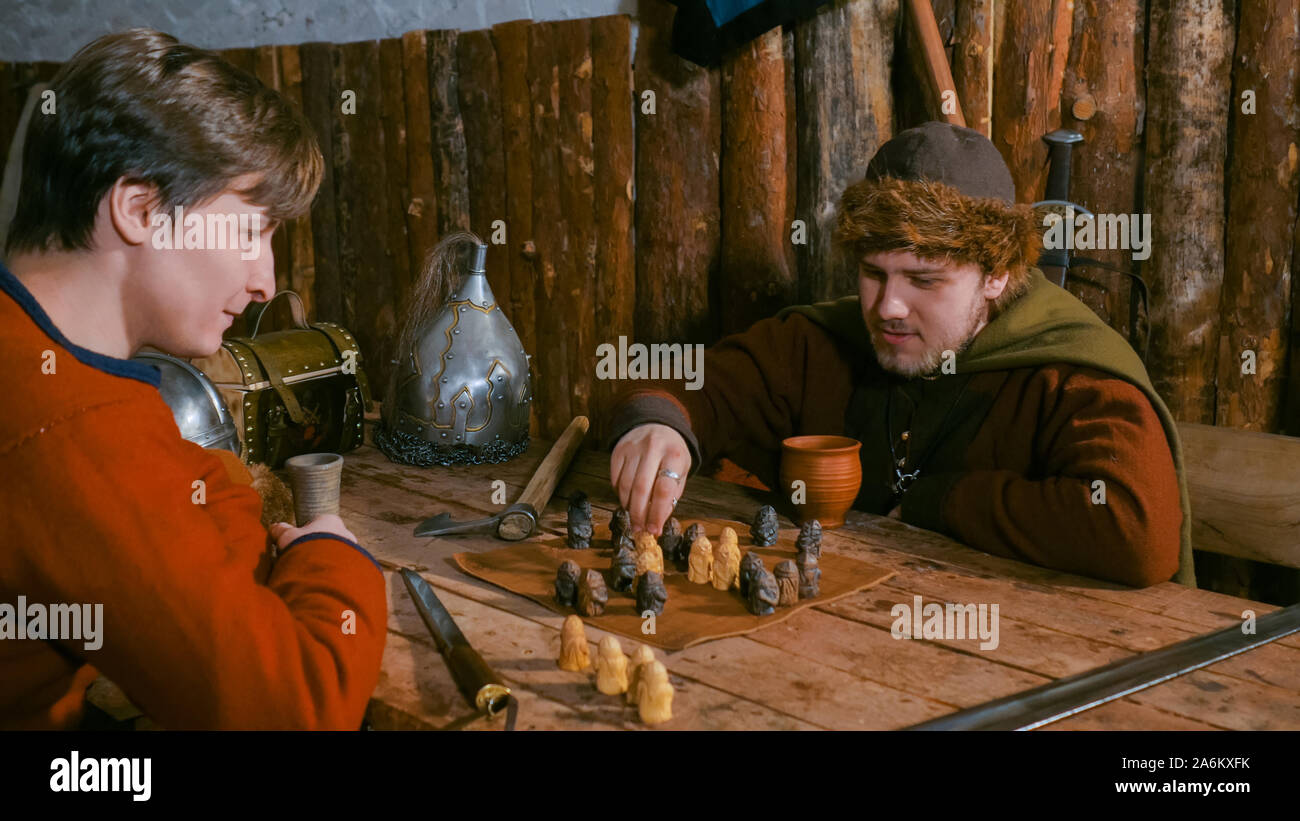 Two men playing popular strategy board game - tafl Stock Photo - Alamy