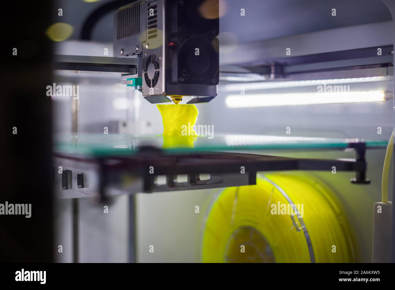 Three dimensional printing machine prints physical 3D model Stock Photo ...