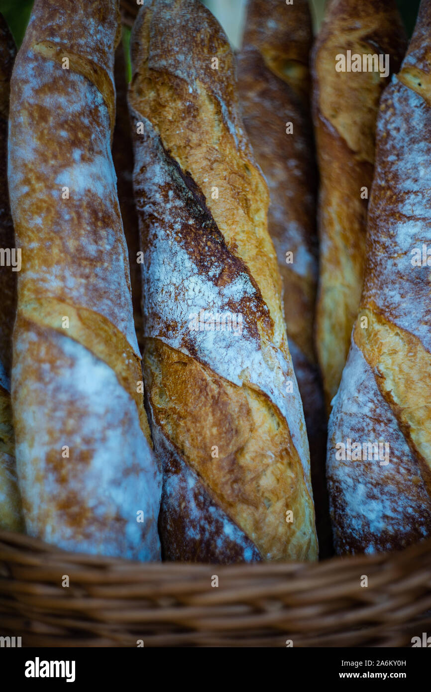 Bakery concept with gold rustic crusty loaves of bread and buns Stock ...