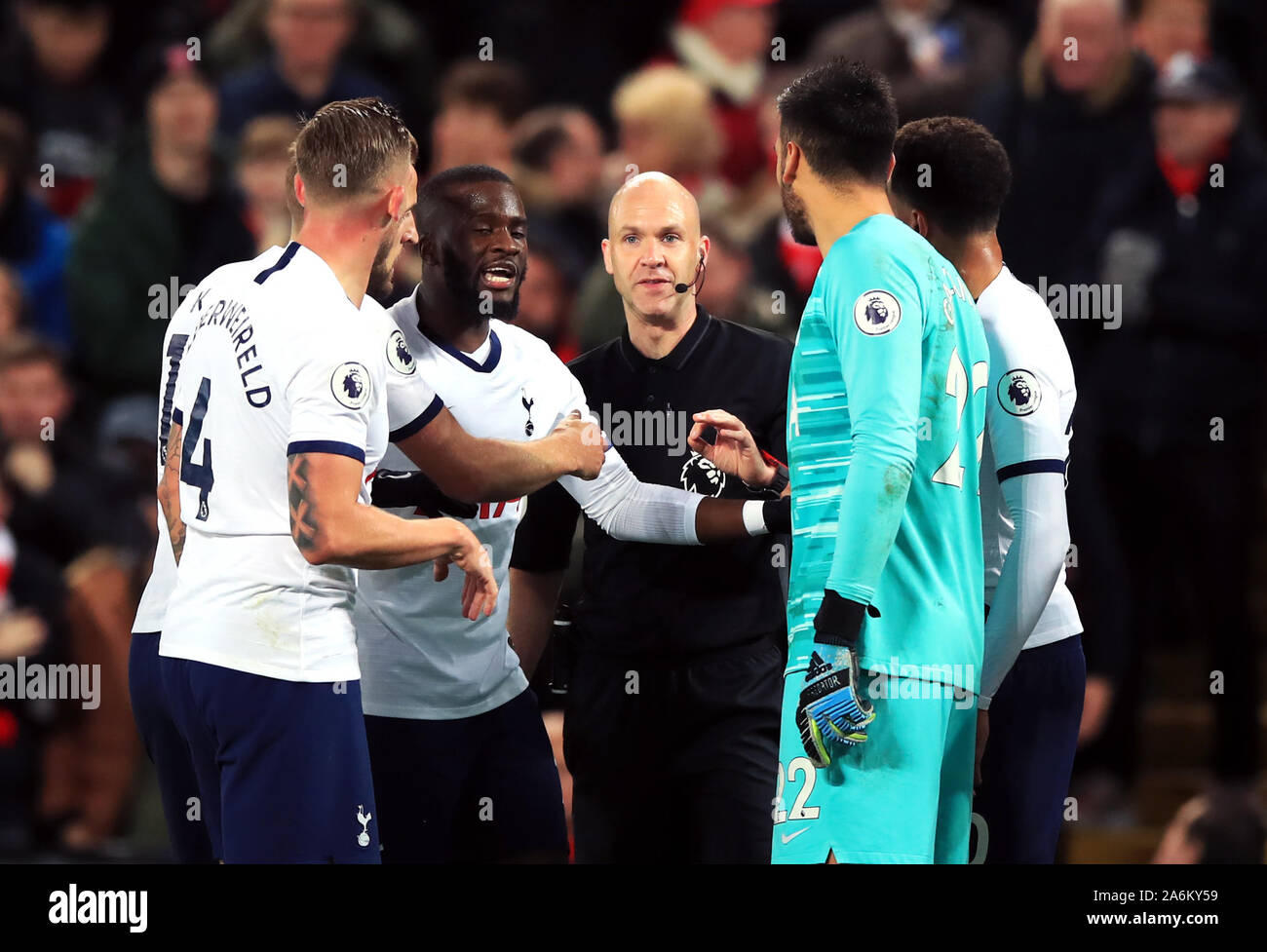 Tottenham hotspur players surround referee anthony taylor hi-res stock ...