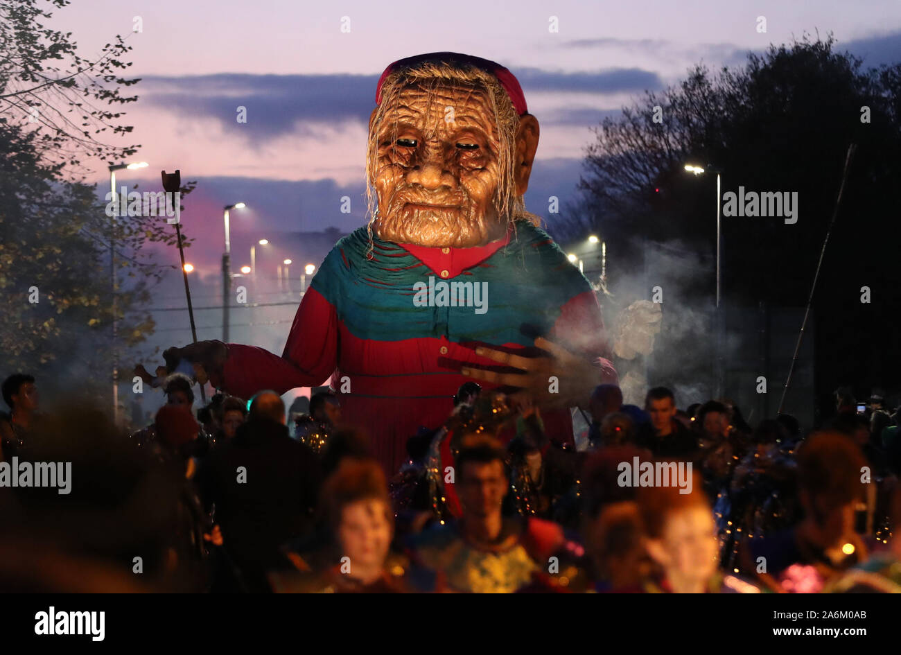 Crowds watch the Macnas Halloween Parade making its way through Galway ...