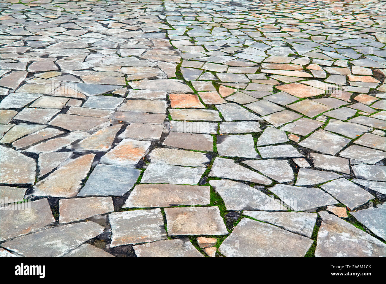 Stone pavement in perspective. Granite cobblestoned pavement background ...