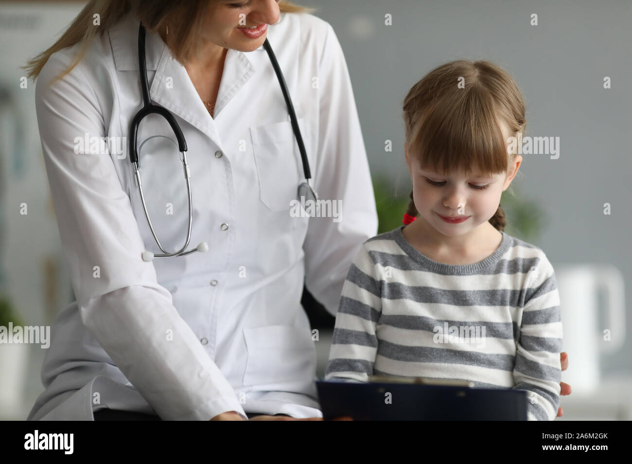 Female doctor exam child patient in hospital Stock Photo - Alamy
