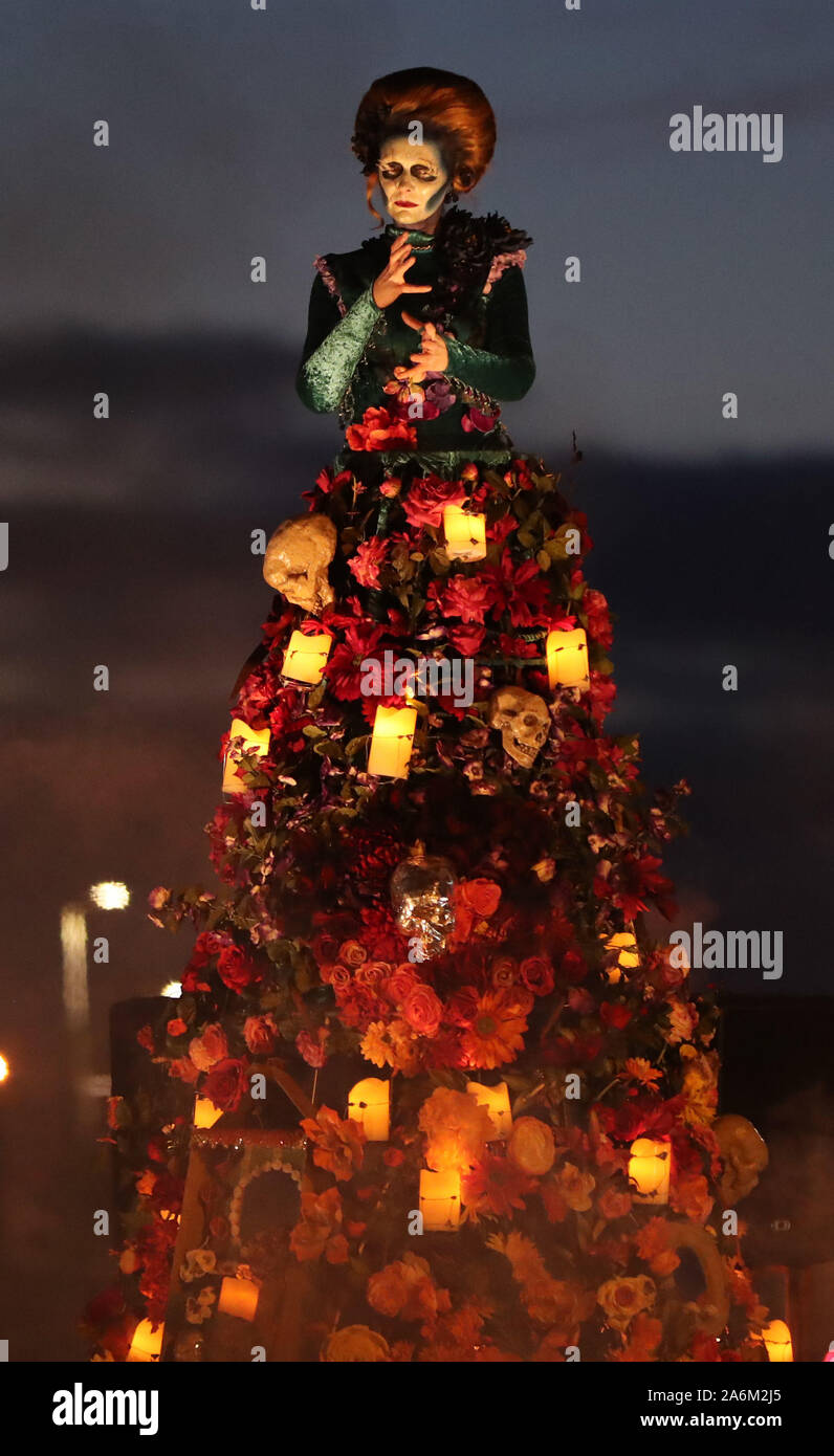 Crowds watch the Macnas Halloween Parade making its way through Galway ...