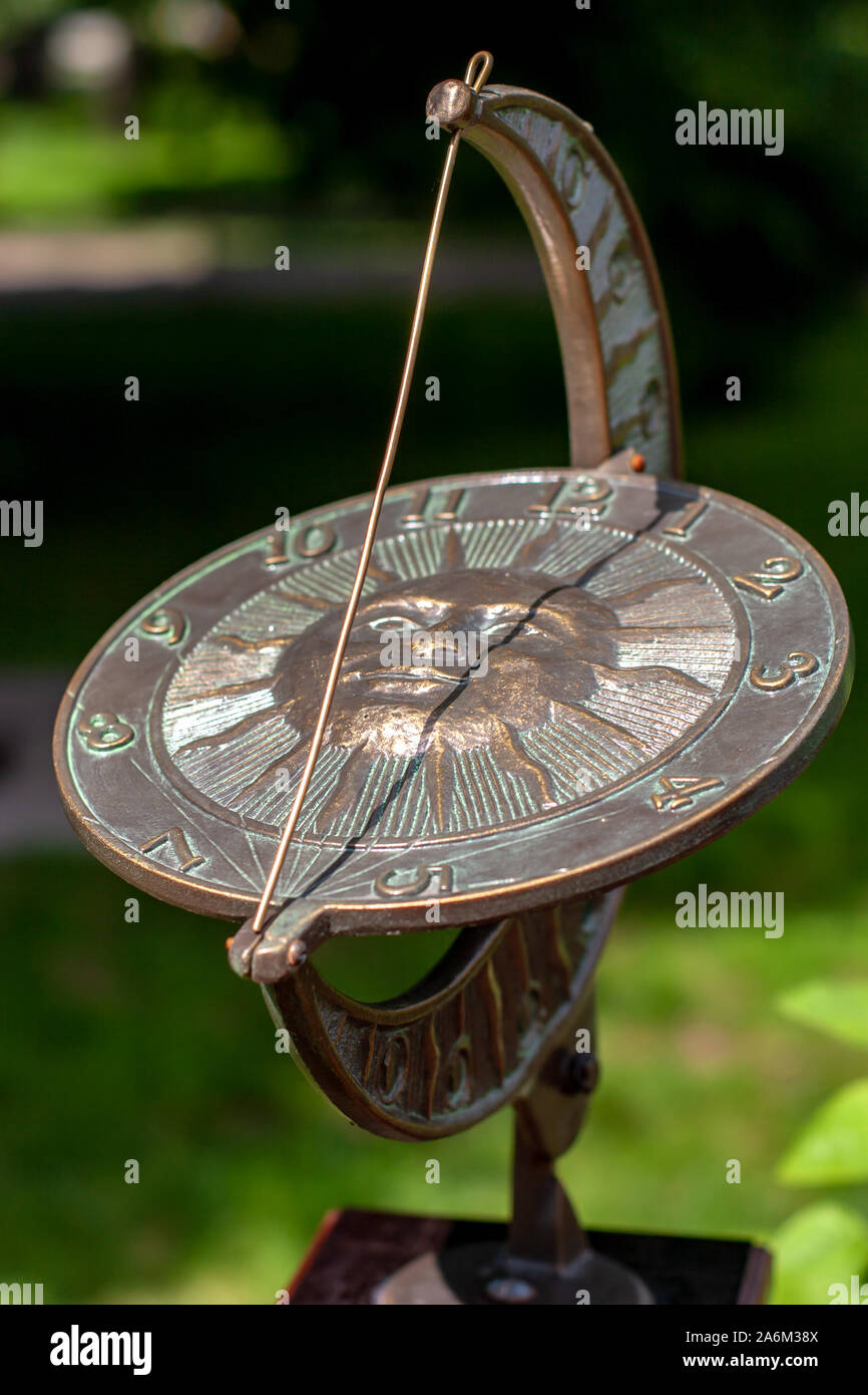 Antique sundial with a beautiful dial with numbers on the edges and the ...