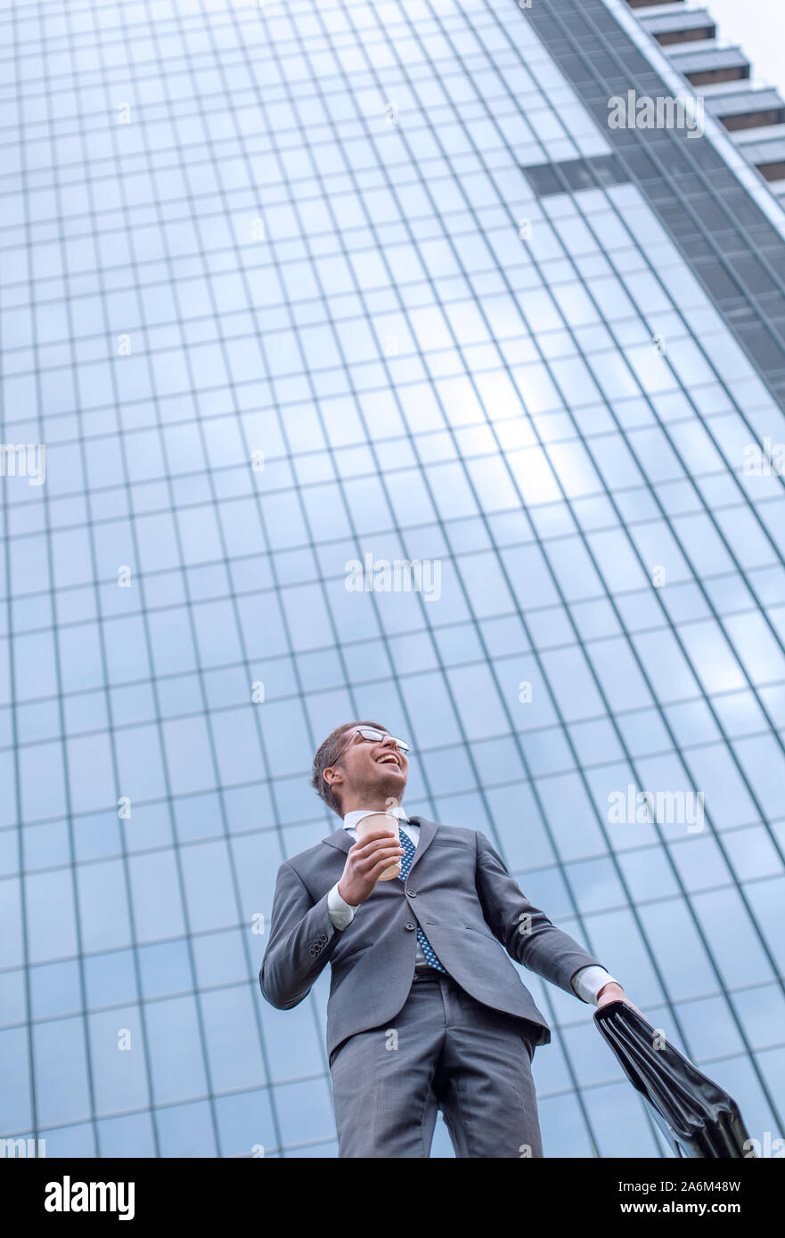 modern business man standing near a tall office building Stock Photo ...