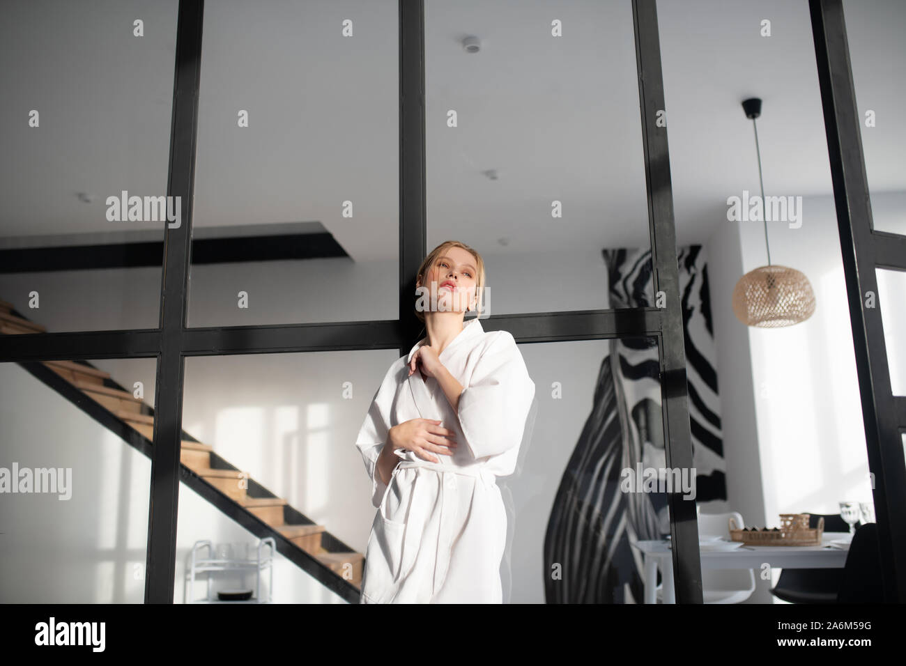 Standing blonde woman inside hi-res stock photography and images - Alamy