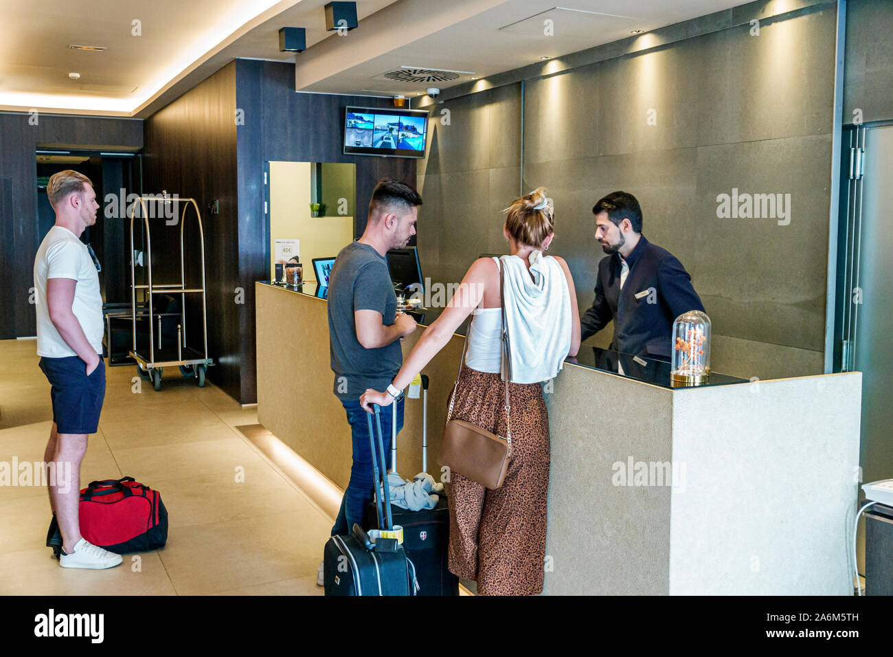 Lobby front reservations check in desk woman female guest hi-res stock ...