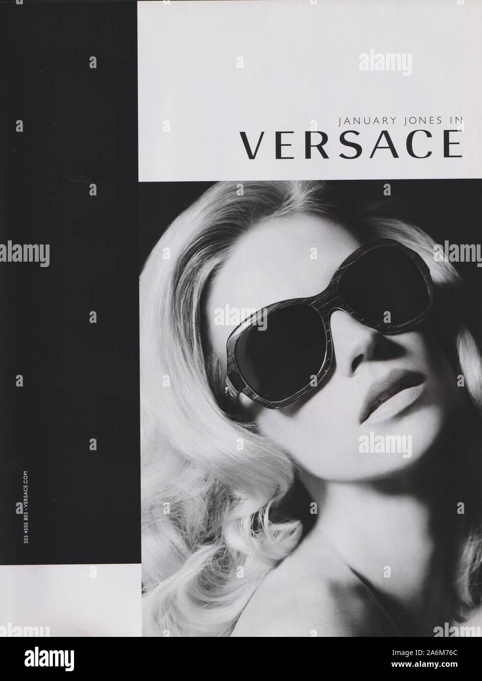 poster advertising VERSACE fashion house with January Jones in paper ...