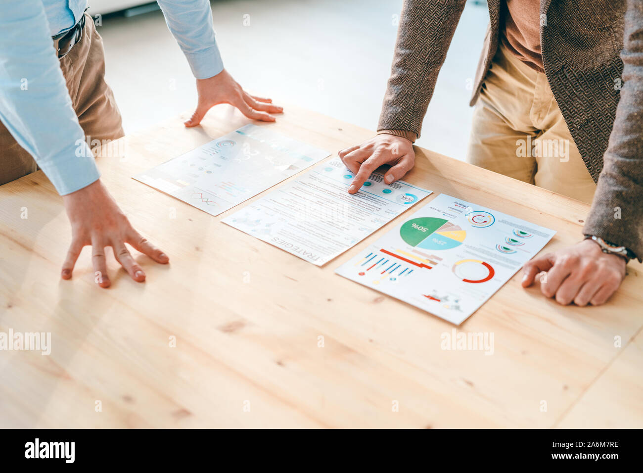 Business team bending over table hi-res stock photography and images ...