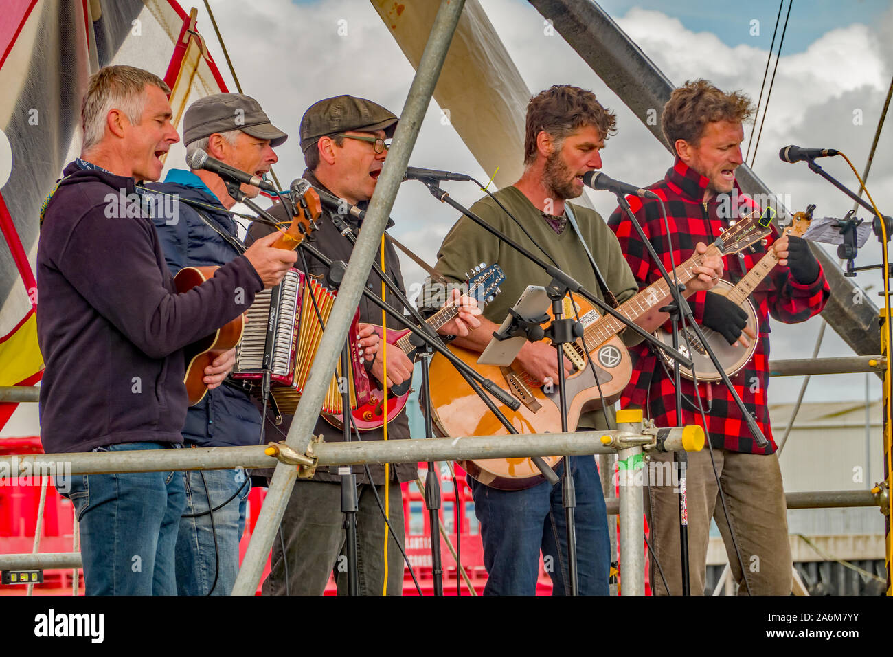 Male vocal group performing in front of a small crowd at the annual ...