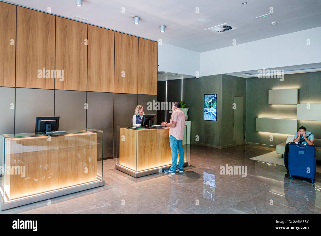 Inside interior lobby front check in reception desk hi-res stock ...
