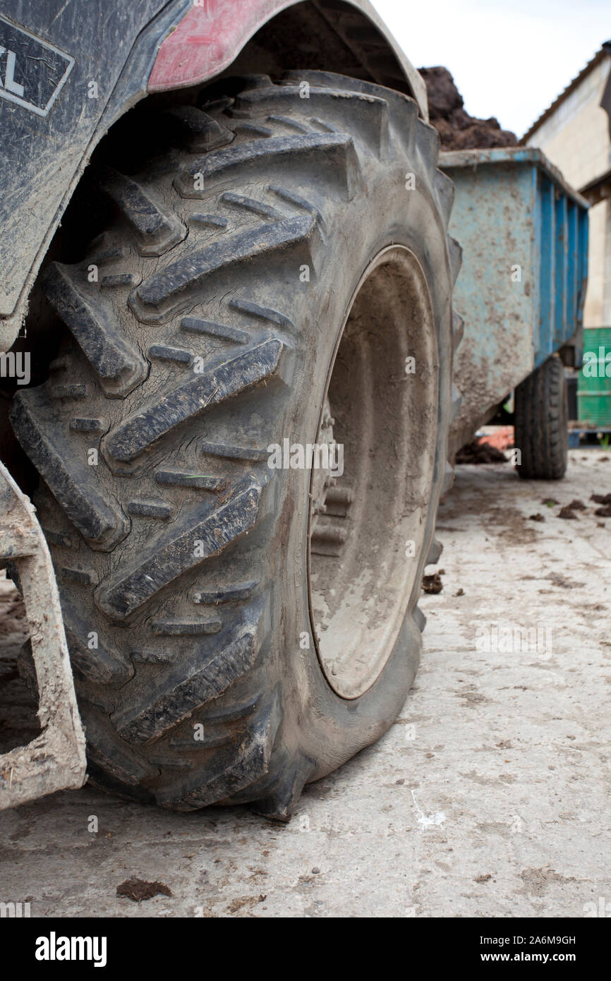 Flat tractor tyre close up Stock Photo - Alamy