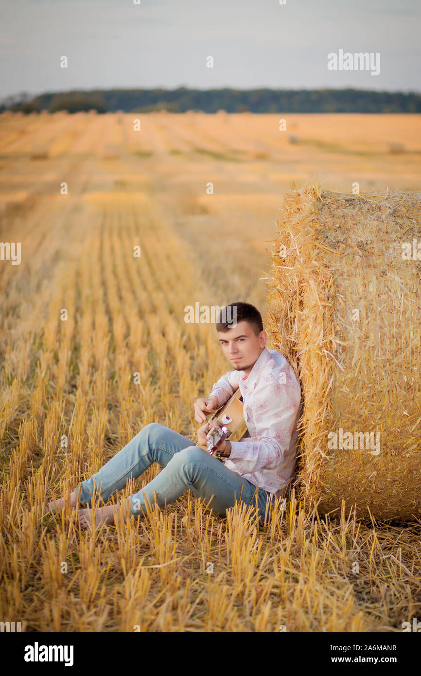 Resting on a bale of hay hi-res stock photography and images - Alamy