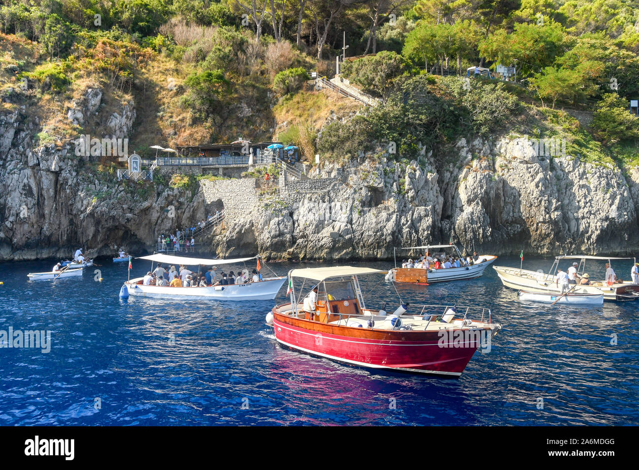 ISLE OF CAPRI, ITALY - AUGUST 2019: Visitors in small boats waiting to ...