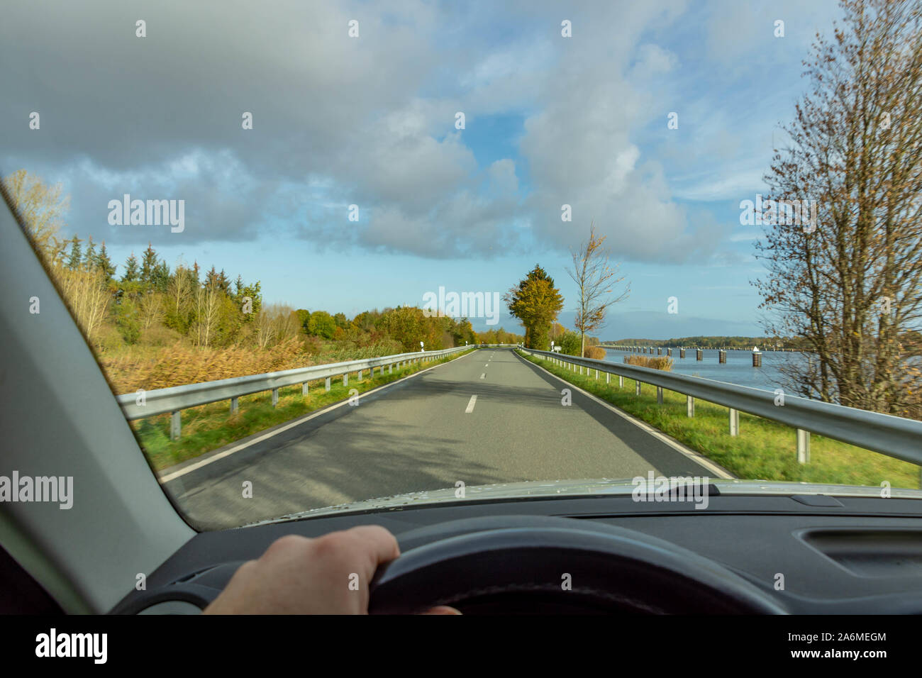 Street view of driver in very nice weather along the Kiel Canal Stock ...