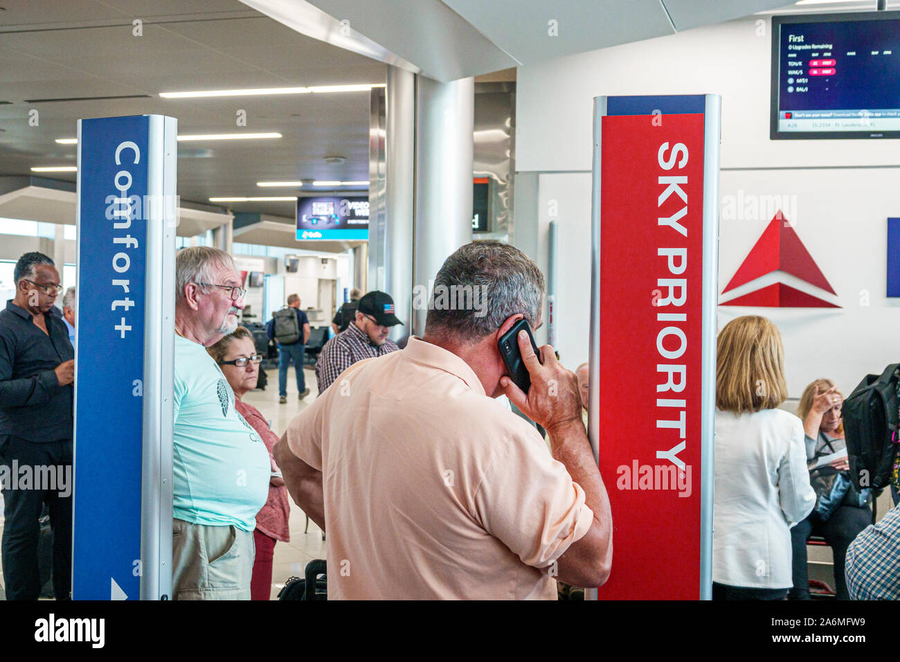 Passengers priority boarding line queue hi-res stock photography and ...