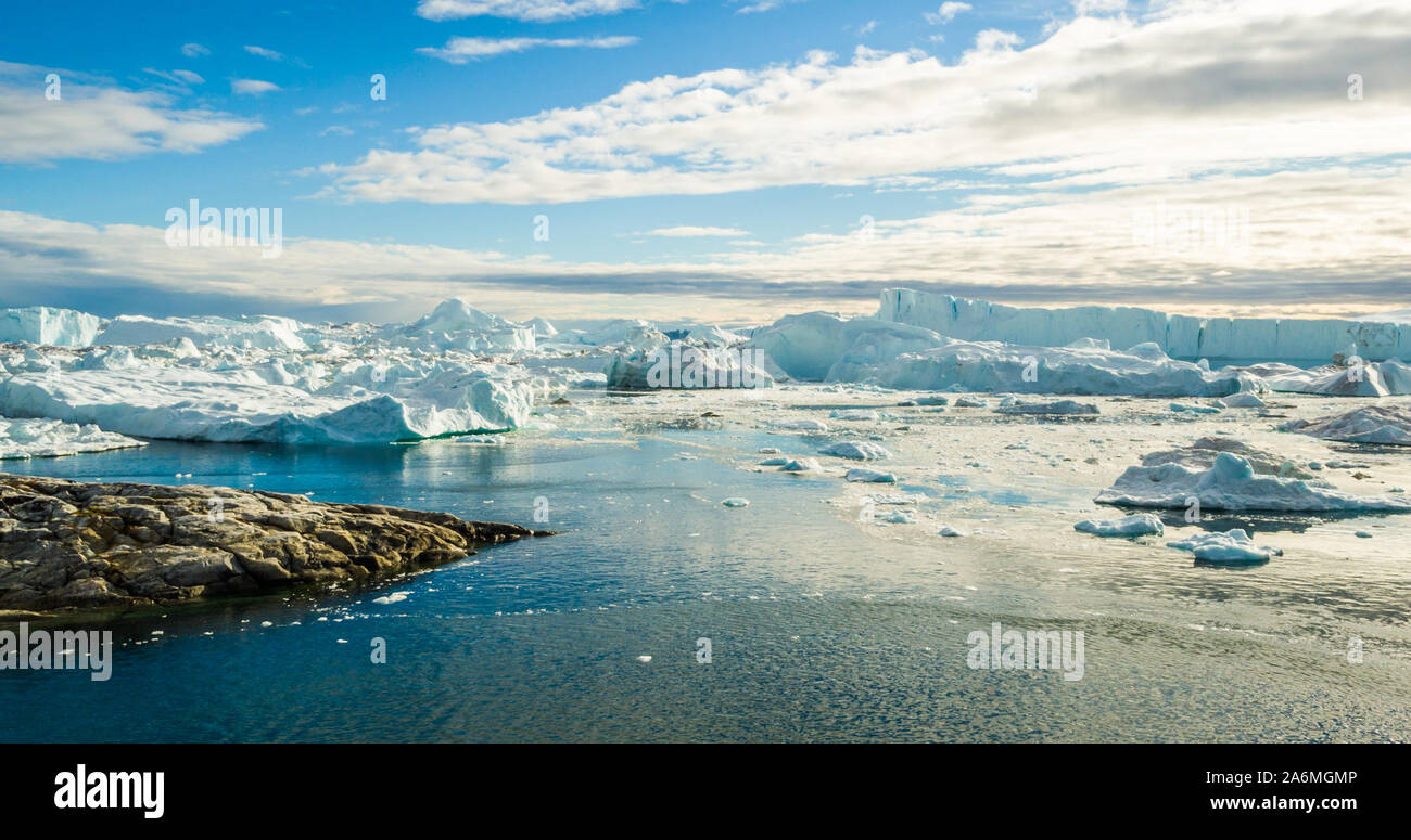 Iceberg and ice from glacier in arctic nature landscape on Greenland ...