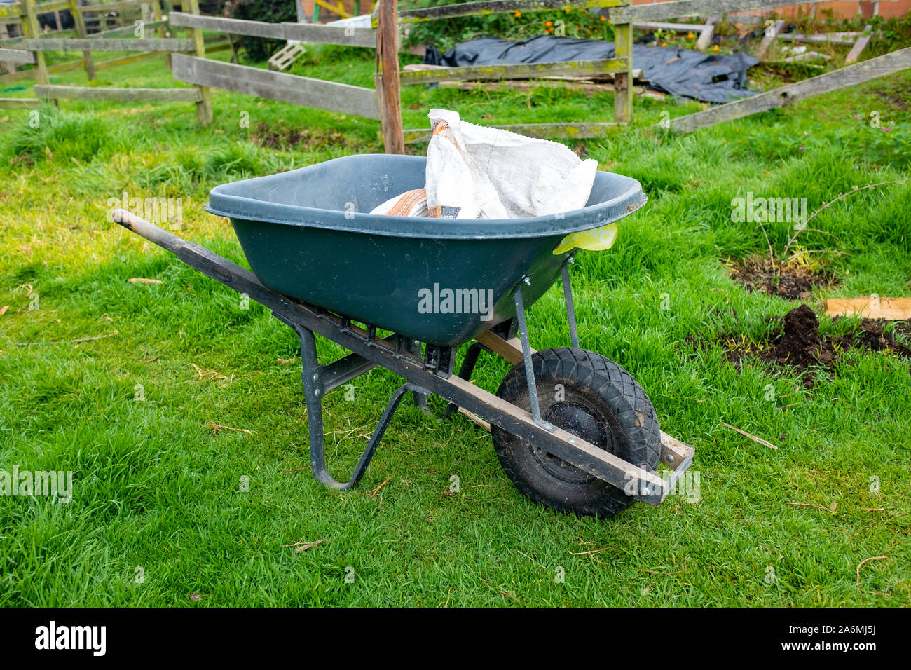 Wheelbarrow Loaded with Construction Materials, on a Farmland Stock ...