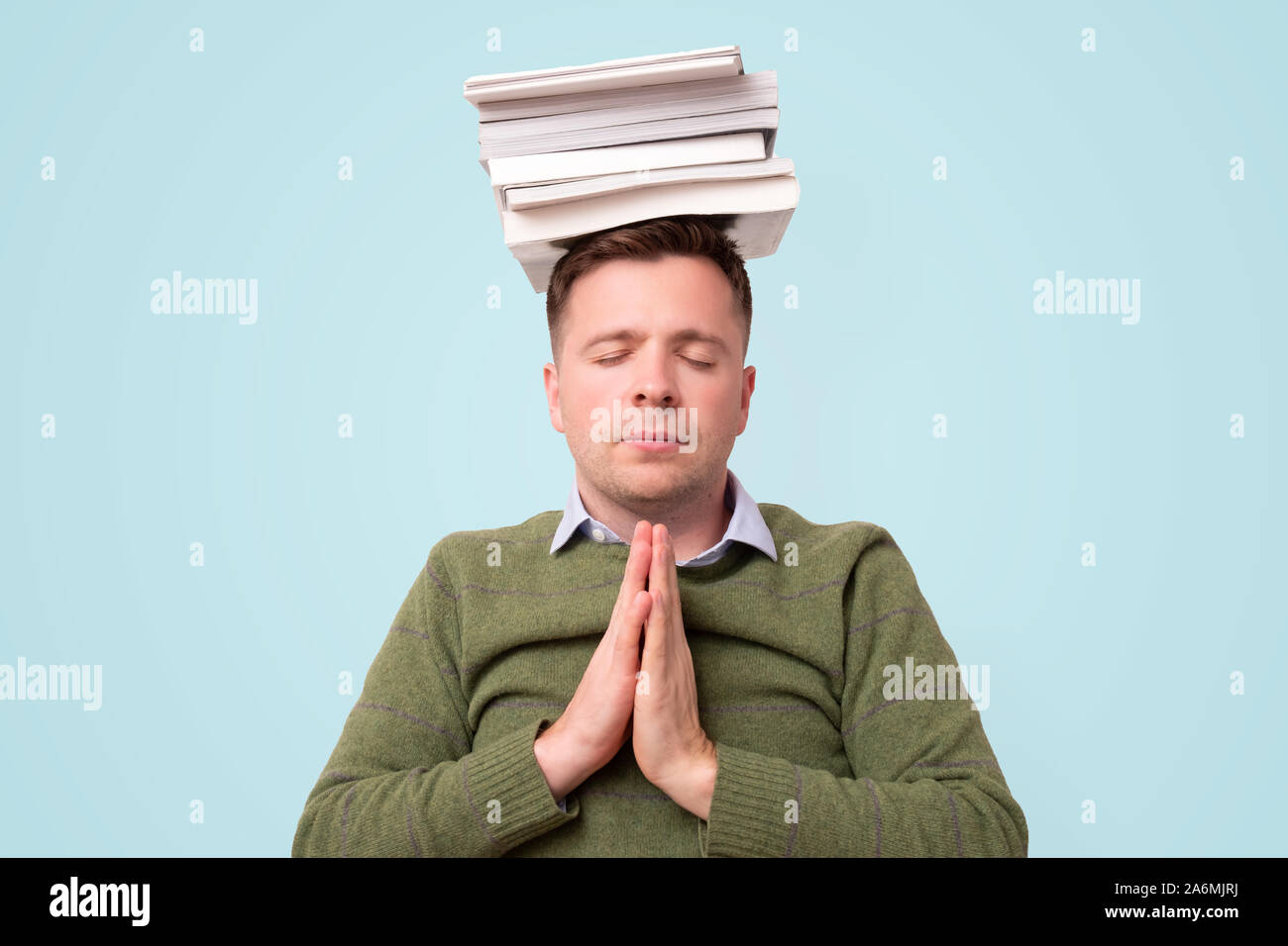 Bored angry tired college student with a book on his head Stock Photo ...