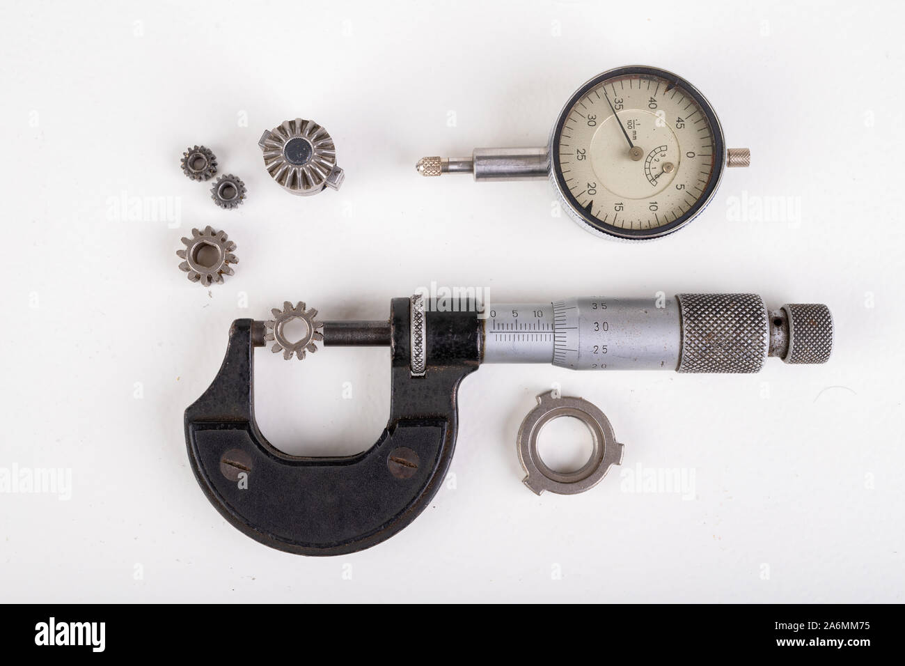 Micrometer, caliper and gear wheels for measurements. Workshop ...