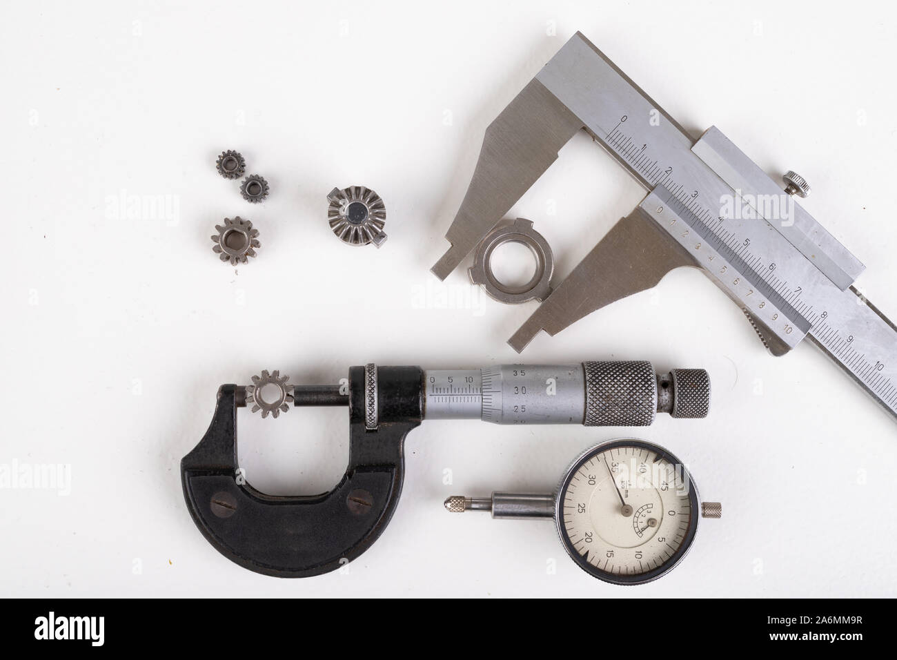 Micrometer, caliper and gear wheels for measurements. Workshop ...