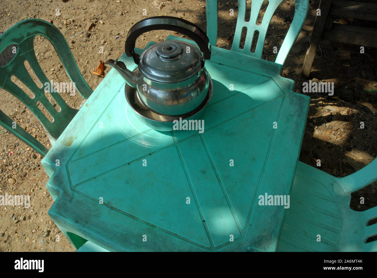 Teapot and set of green plastic chairs, Yangon, Myanmar, Asia Stock ...