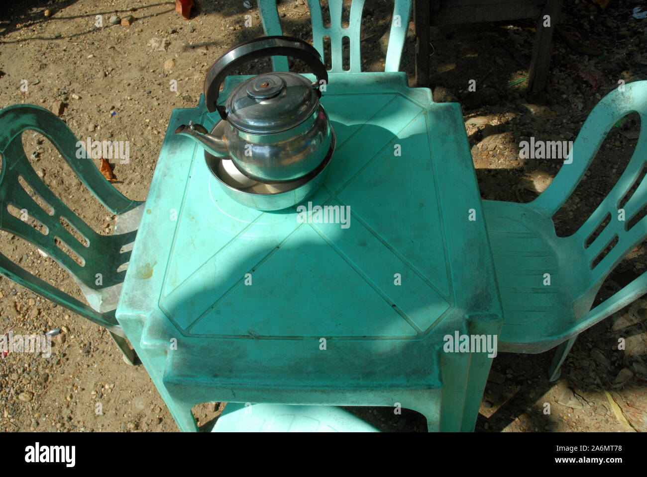 Teapot and set of green plastic chairs, Yangon, Myanmar, Asia Stock ...