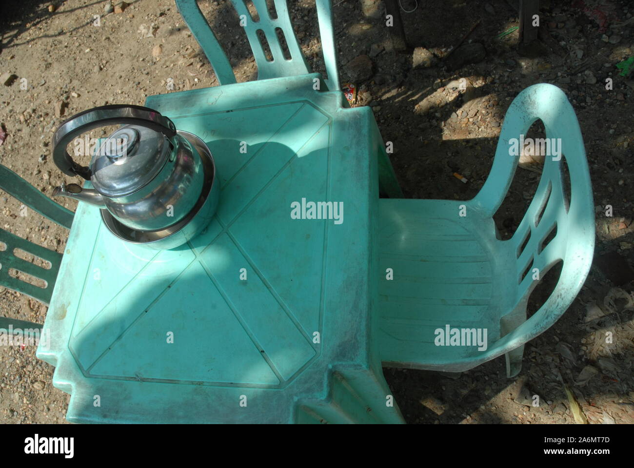 Teapot and set of green plastic chairs, Yangon, Myanmar, Asia Stock ...
