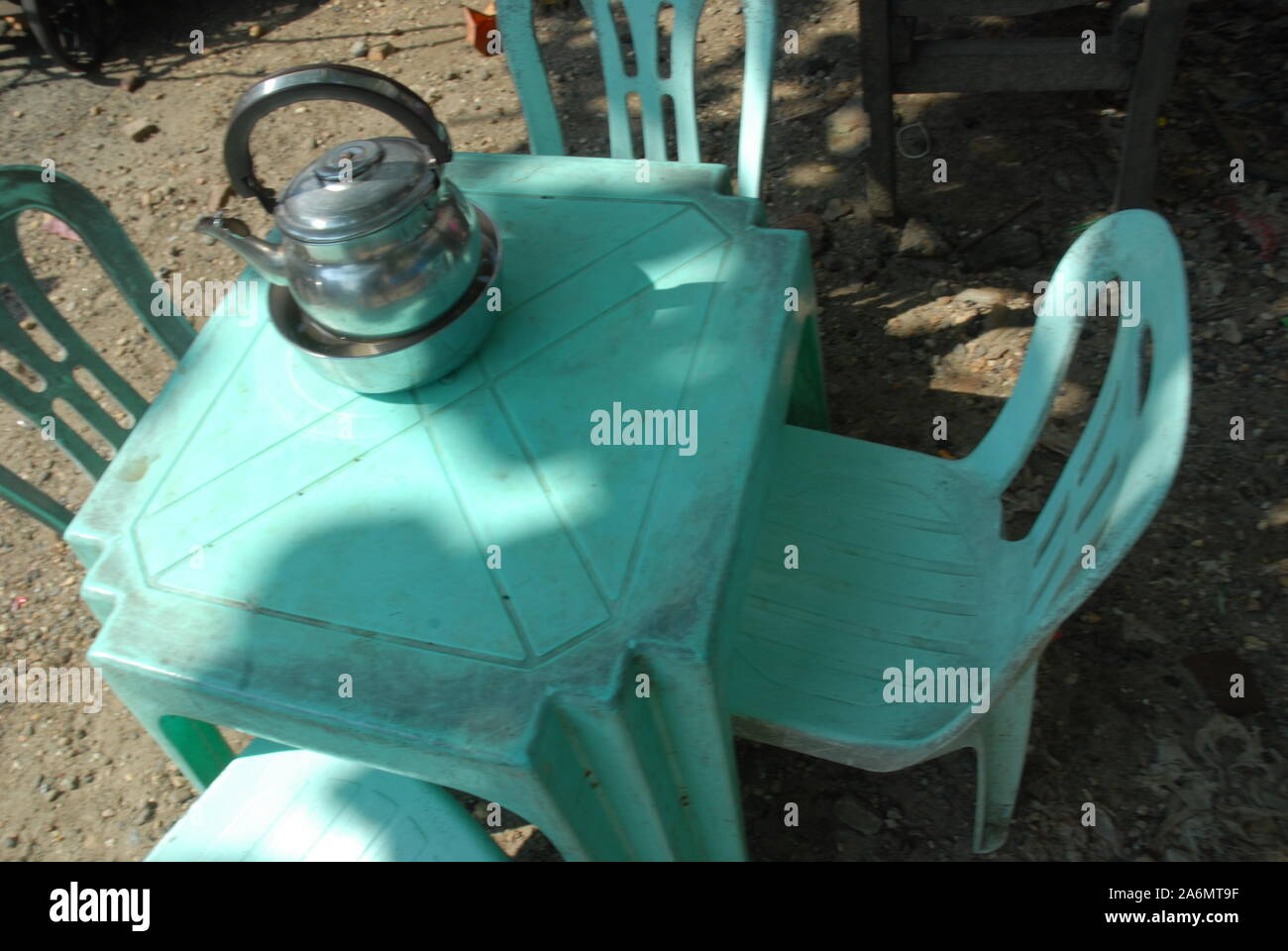 Teapot and set of green plastic chairs, Yangon, Myanmar, Asia Stock ...