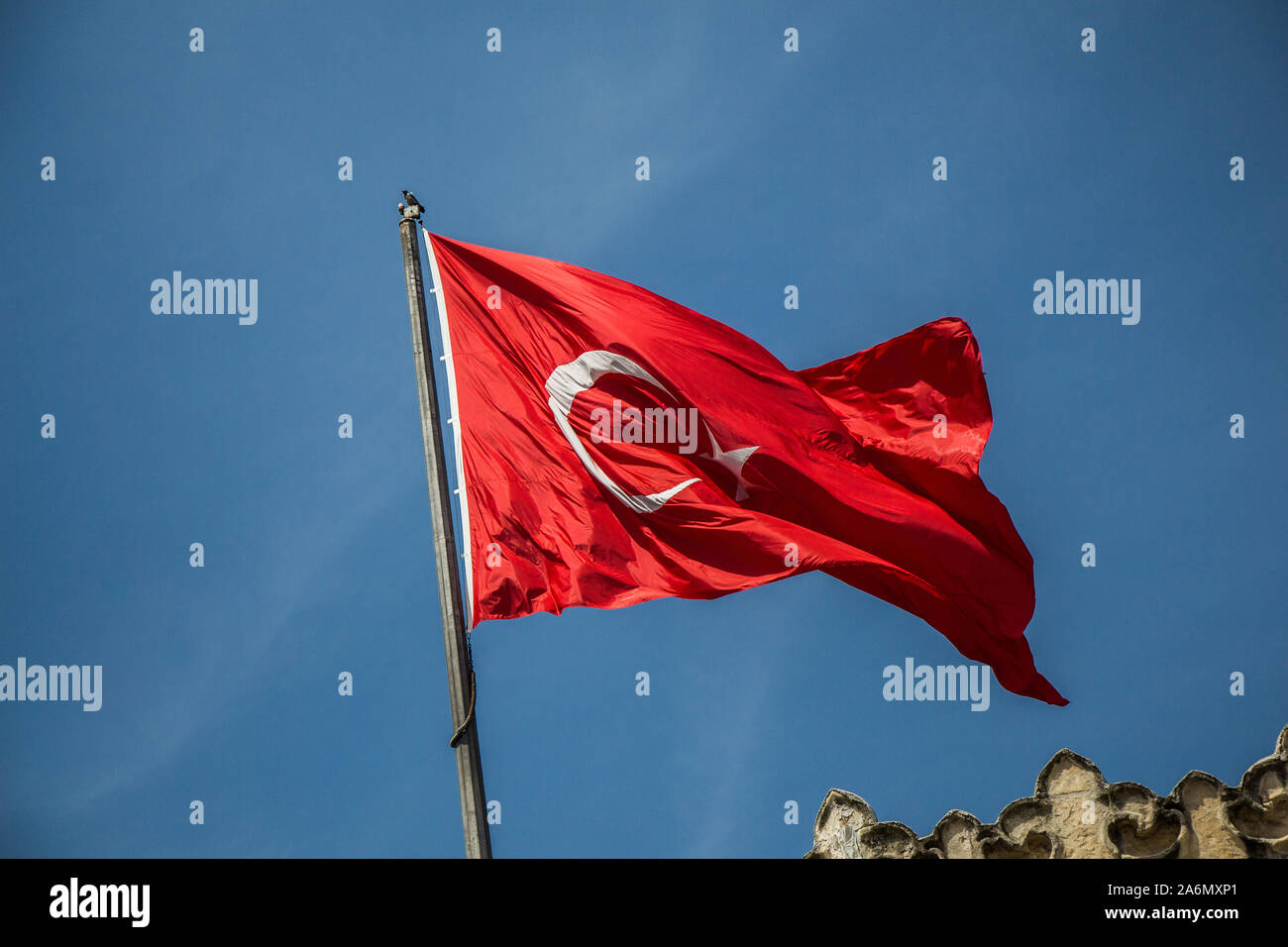 Turkish national flag with white star and moon in sky Stock Photo - Alamy
