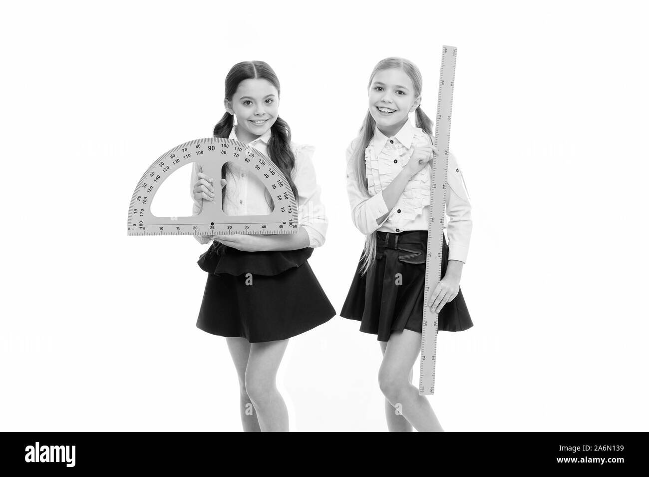 An important lesson. Little girls preparing for geometry lesson. Cute ...