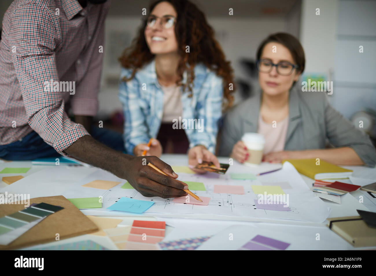 Creative business team working on design project focus on table with ...
