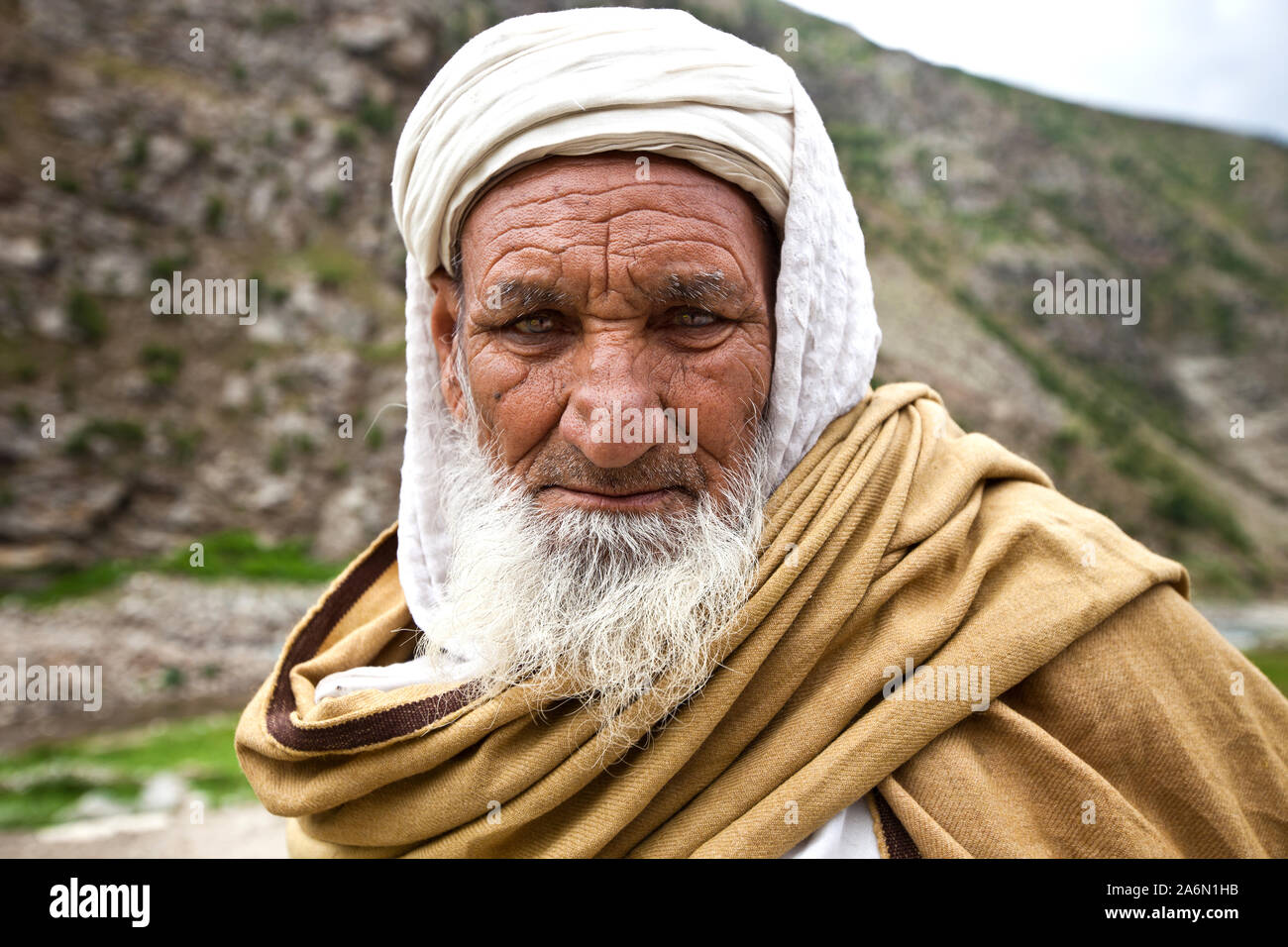 Portrait of a man in the mountain areas of Pakistan Stock Photo - Alamy