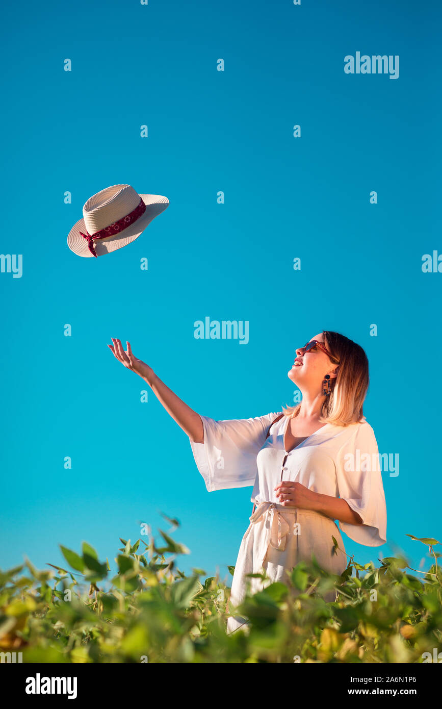 Woman throwing clothes hi-res stock photography and images - Alamy