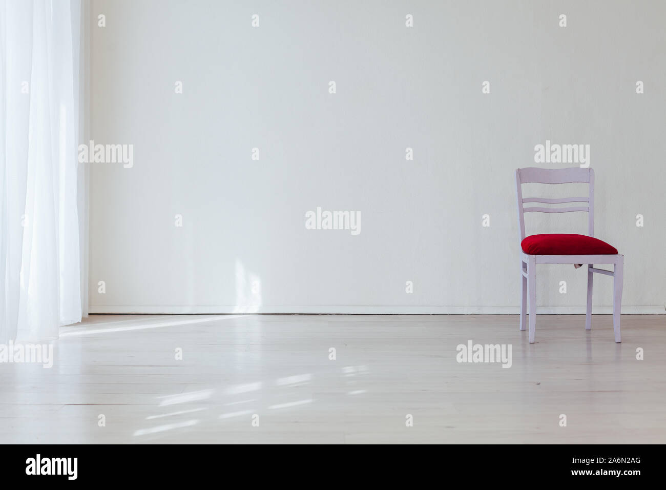 one vintage chair in the interior of the white room Stock Photo - Alamy