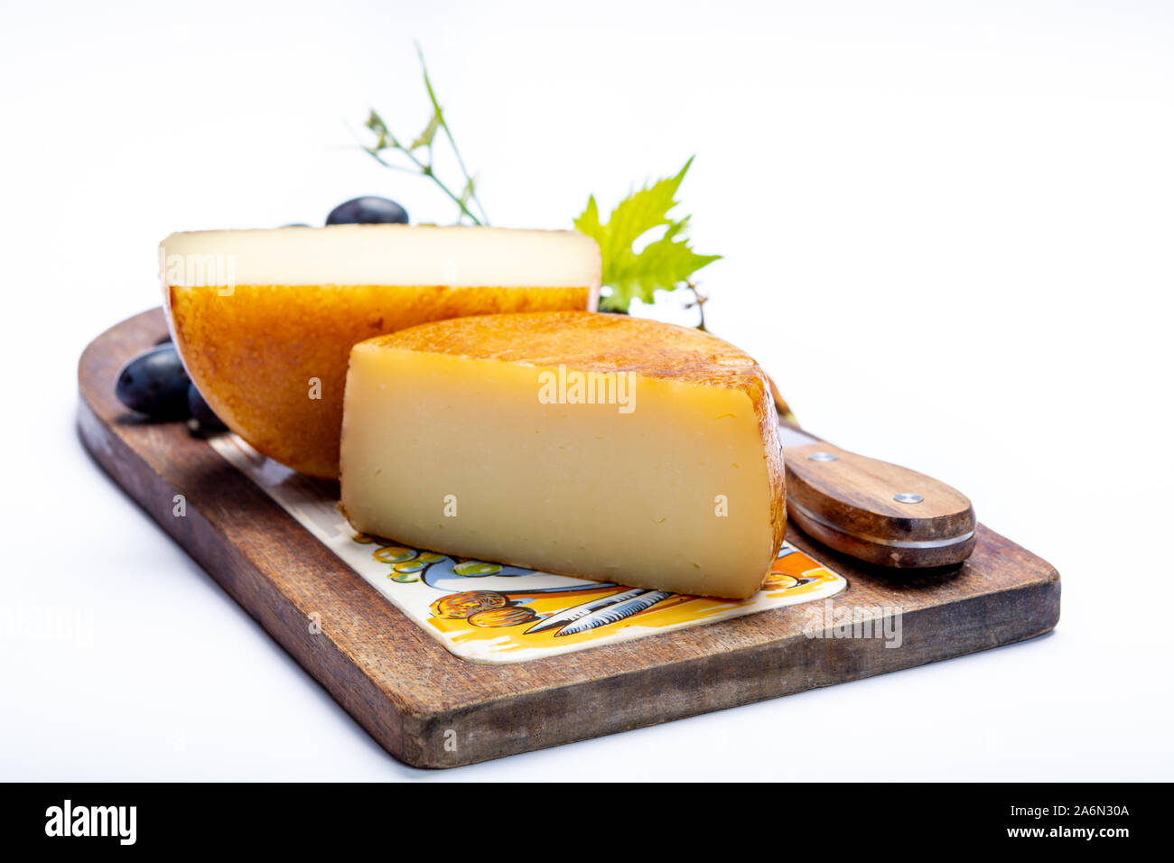 Hard Italian pecorino sheep cheese in two pieces close up isolated ...