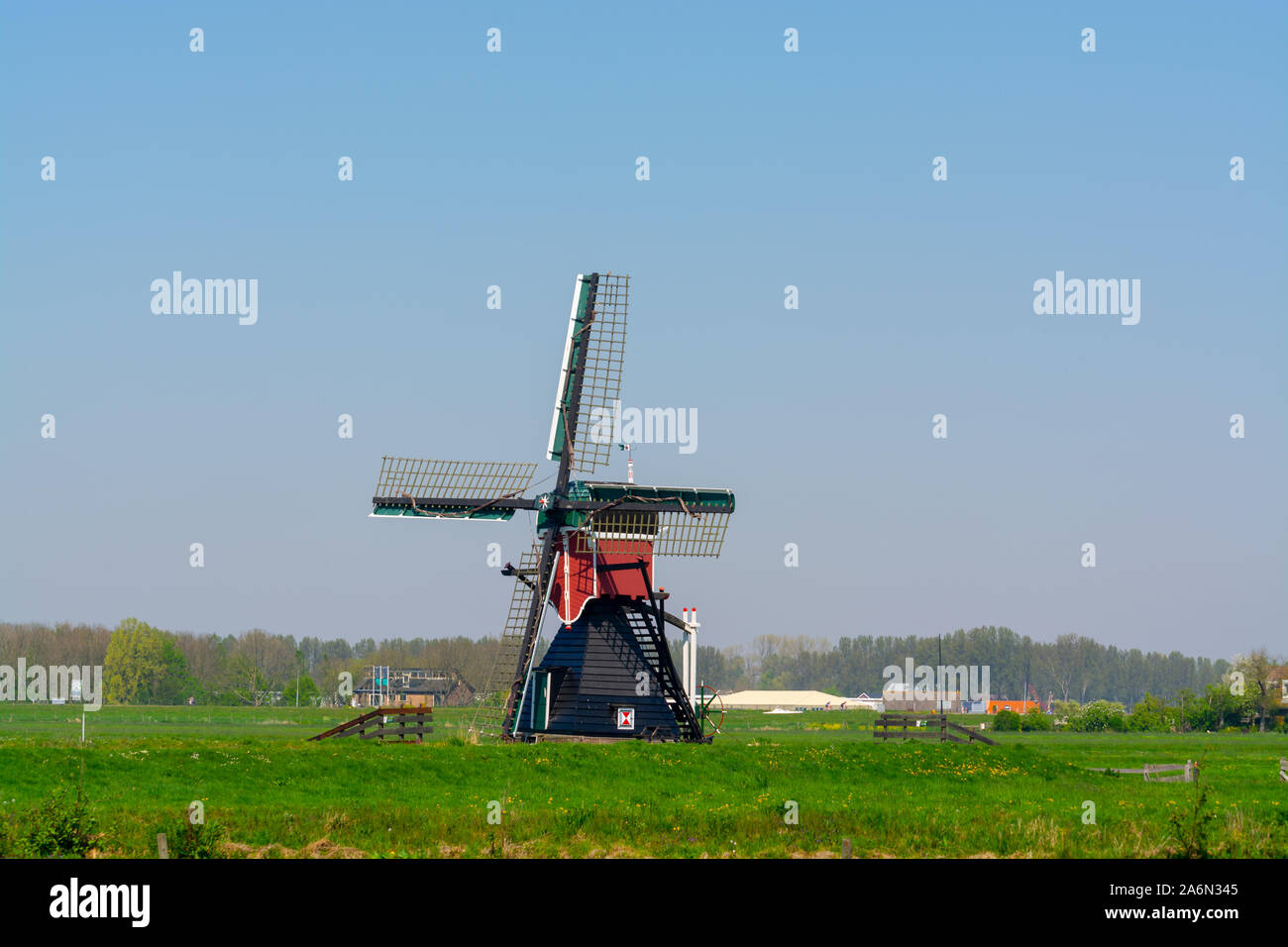 View on traditional Dutch wind mill, spring landscape in North Holland ...