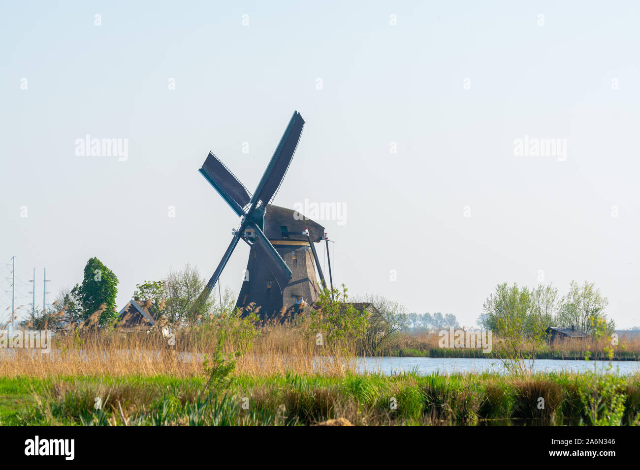 Waterways of North Holland and view on traditional Dutch wind mill ...