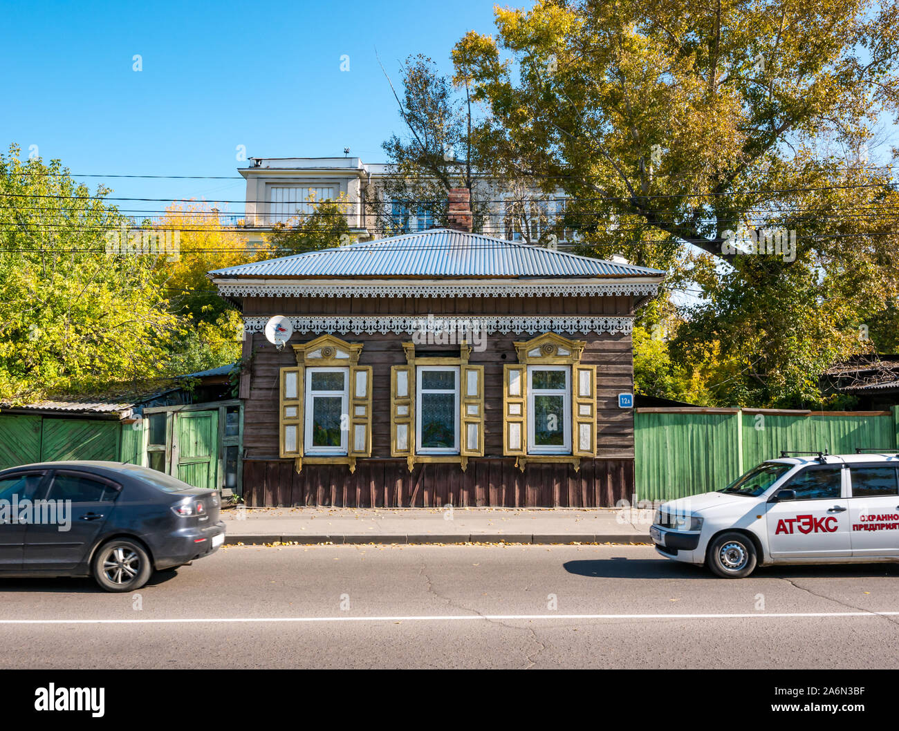 Traditional historic small wooden house, with shuttered windows ...