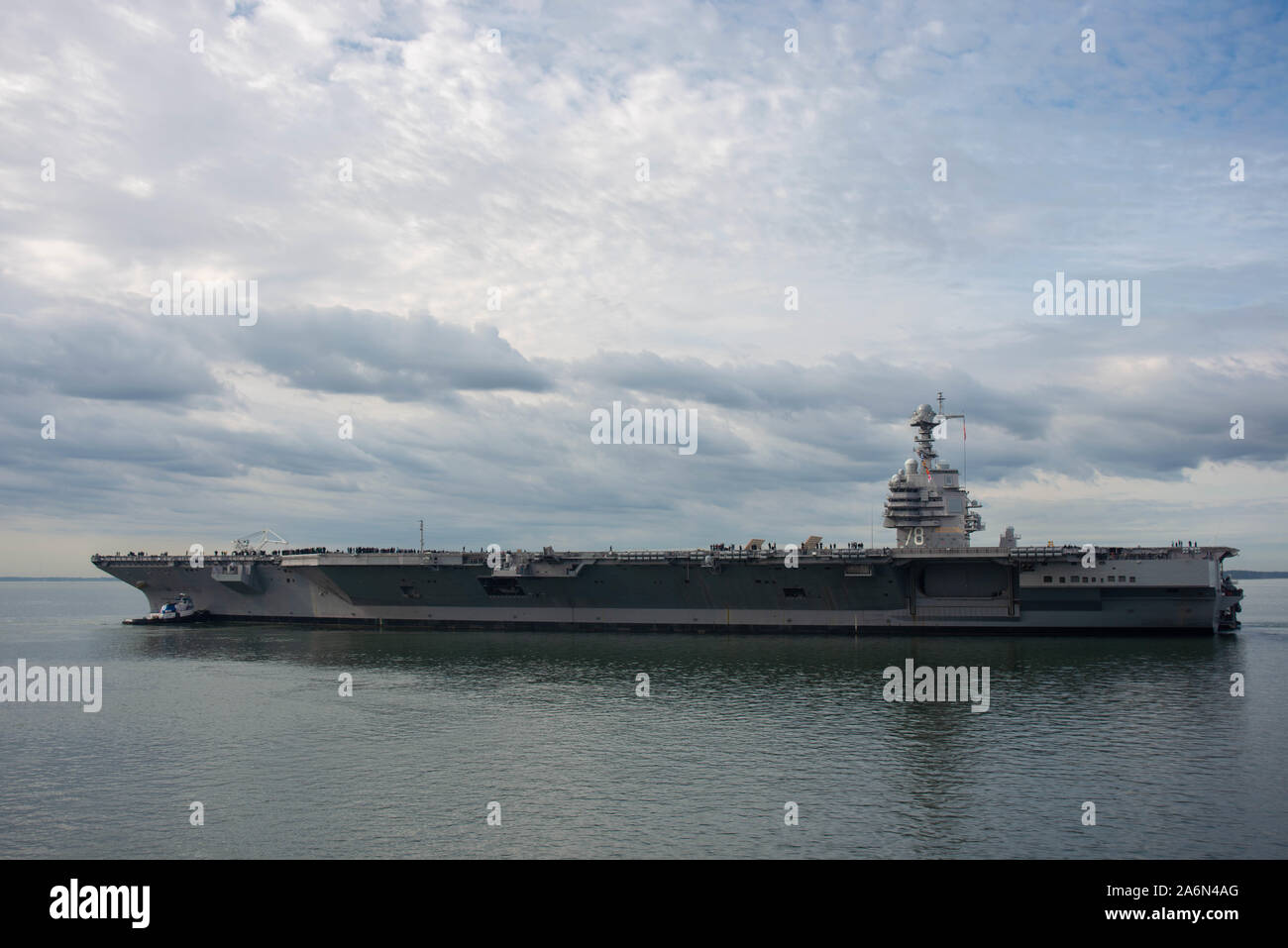 NEWPORT NEWS, Va. (Oct. 25, 2019) - Tugs direct the bow of USS Gerald R ...