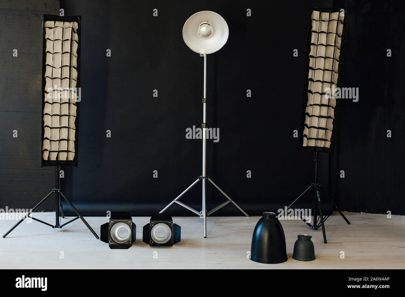 Photo studio equipment flash accessories photographer on black ...