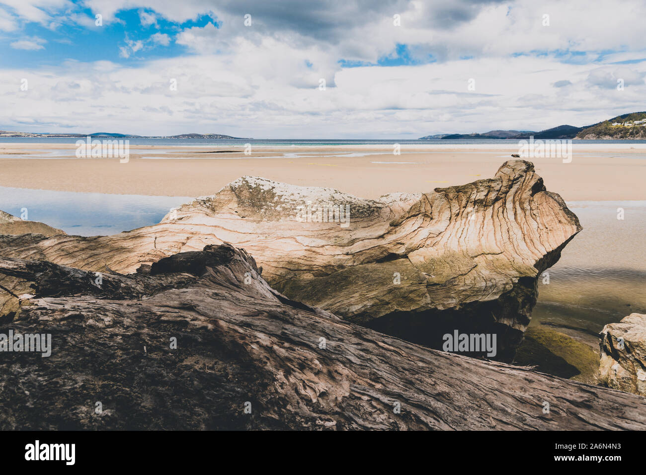 pristine Australian coastline and beach landscape with blue Pacific Ocean water and golden sand ...