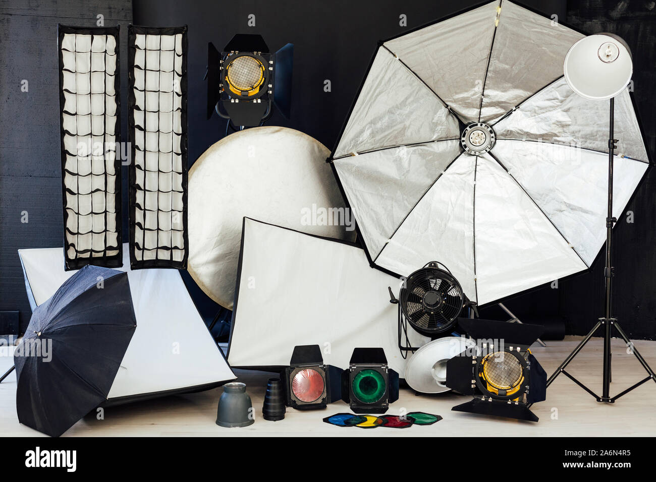 Photo studio equipment flash accessories photographer on black ...