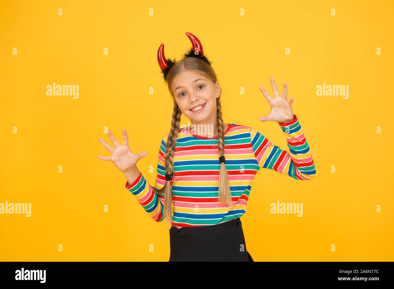She devil. Halloween party girl yellow background. Little girl wear red ...