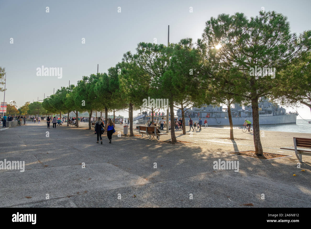 Greek warship destroyer Velos D-16 at waterfront. Crowd que to visit ...