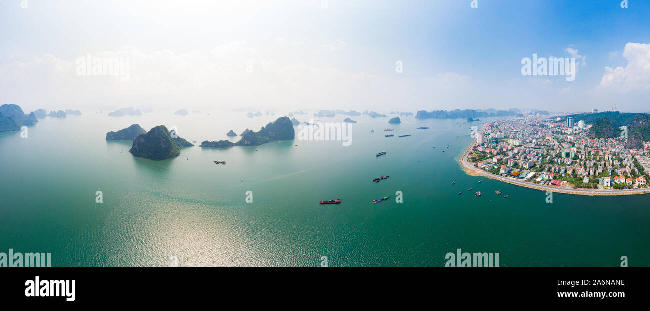 Aerial view of Ha Long Bay and Halong City skyline, unique limestone ...