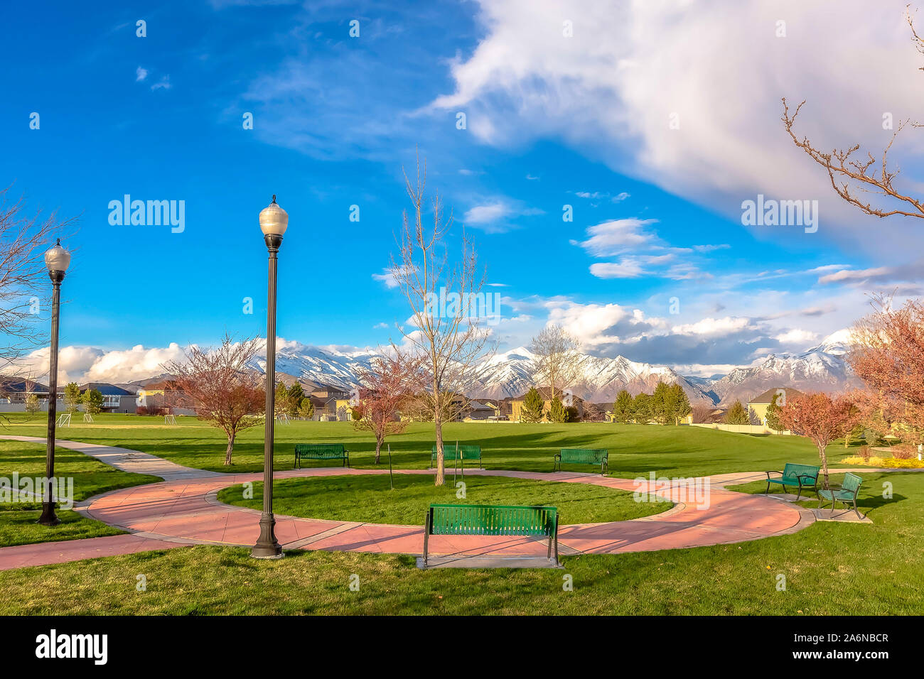 Circular footpath in an urban park with grass Stock Photo - Alamy