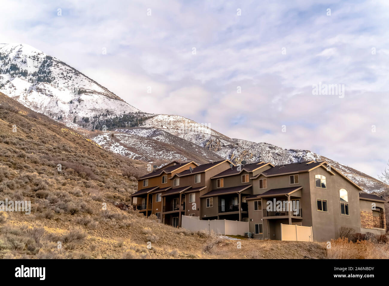 Cluster housing development on a mountain slope Stock Photo - Alamy
